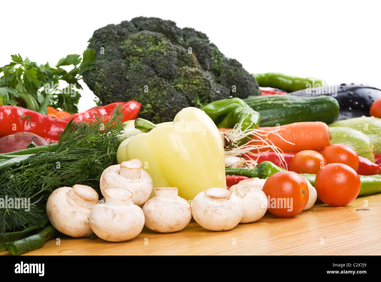 Fresh vegetables for all seasons on wood table in kitchen Stock Photo ...