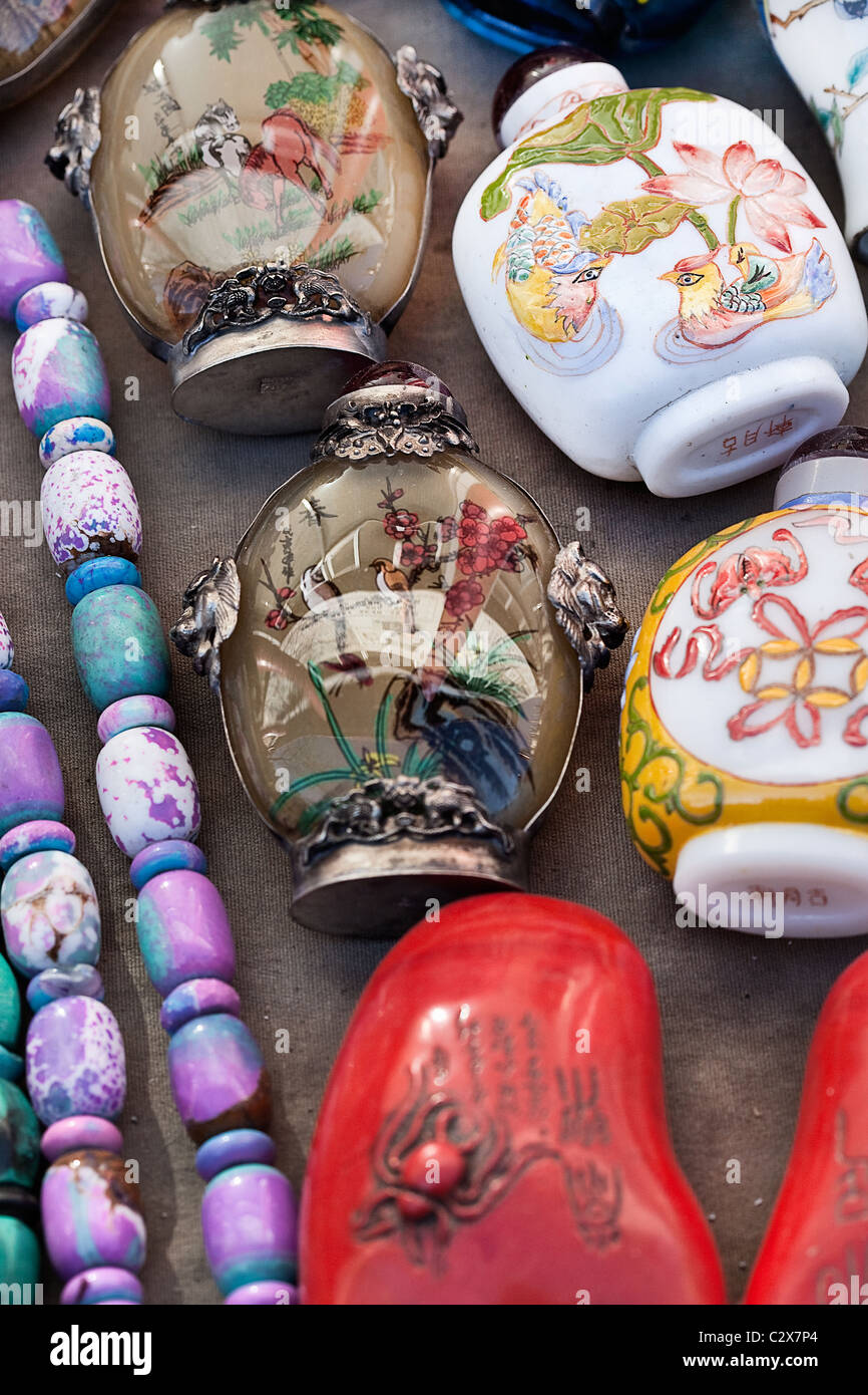 Close up photo from high angle of a few small ceramic bottles with ...