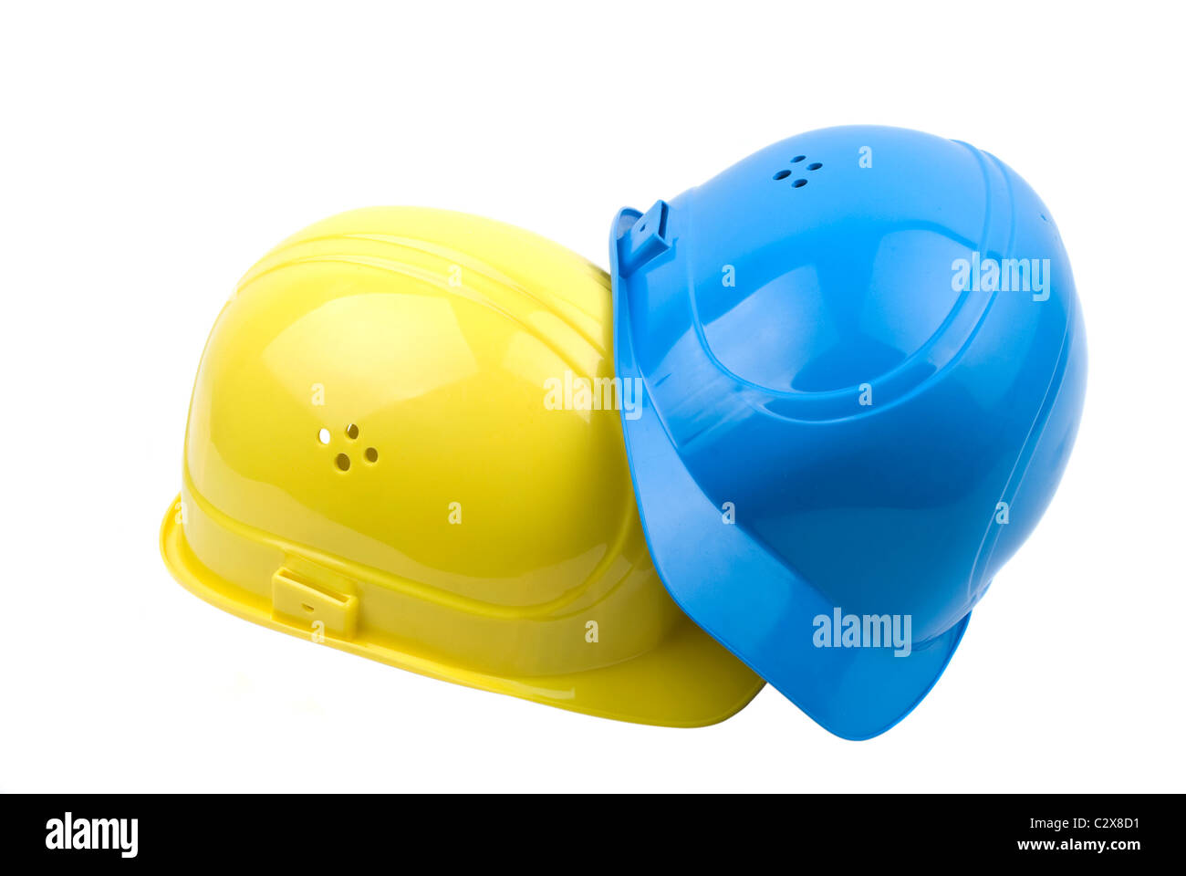 Two helmet yellow and blue isolated on white background Stock Photo - Alamy