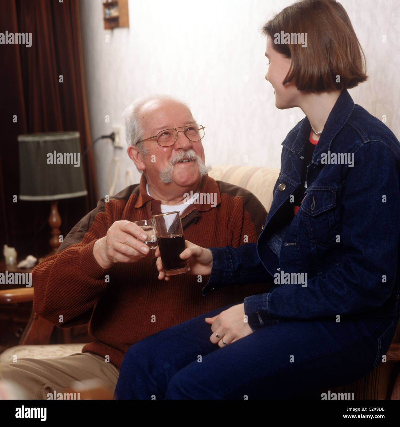 Teenager helping old people, voluntary work Stock Photo - Alamy