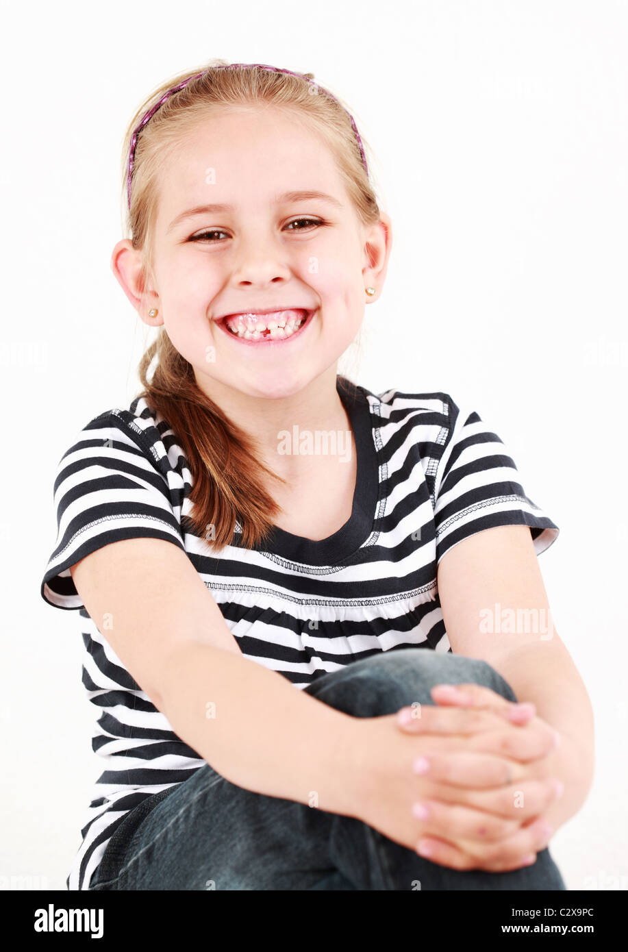 Happy girl with her first missing tooth Stock Photo - Alamy