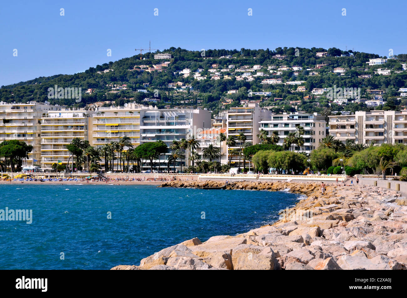 Famous bay of cannes in France with the beach and buildings in the ...