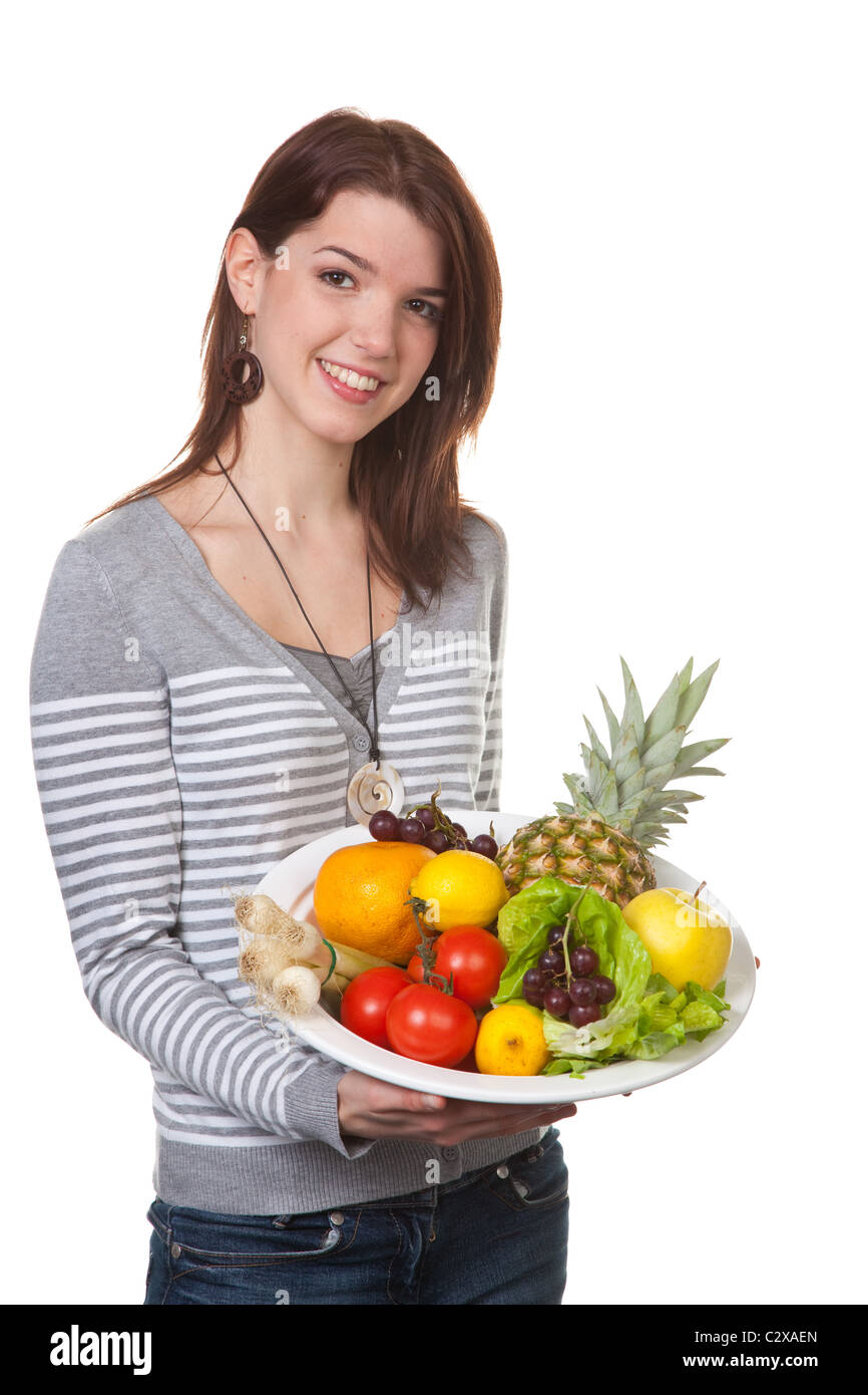 Young woman presenting a fruit plate Stock Photo - Alamy