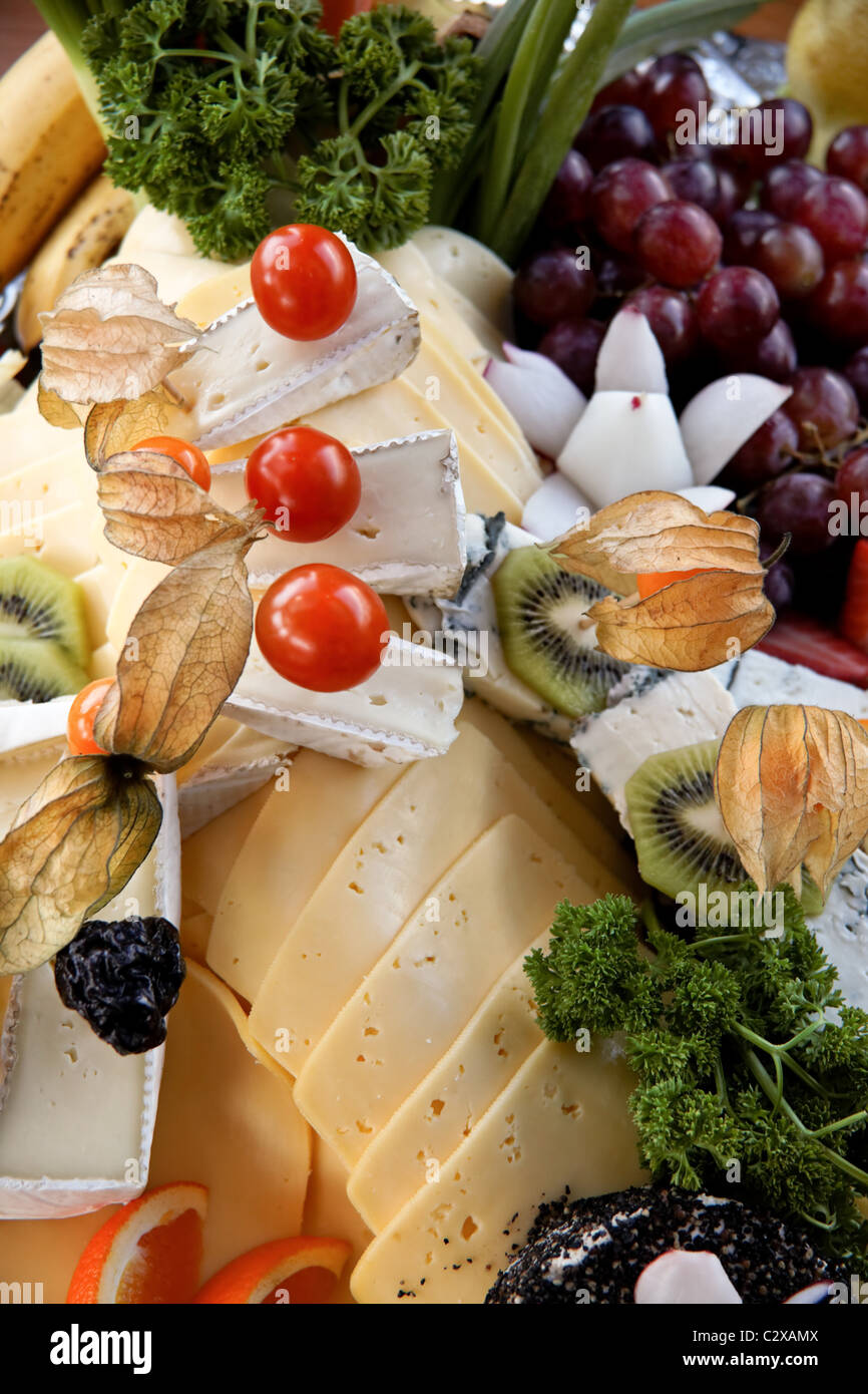 Cheese plate with a cold buffet Stock Photo - Alamy