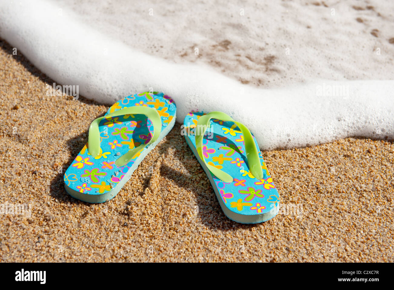 Flip flops at the beach Stock Photo - Alamy