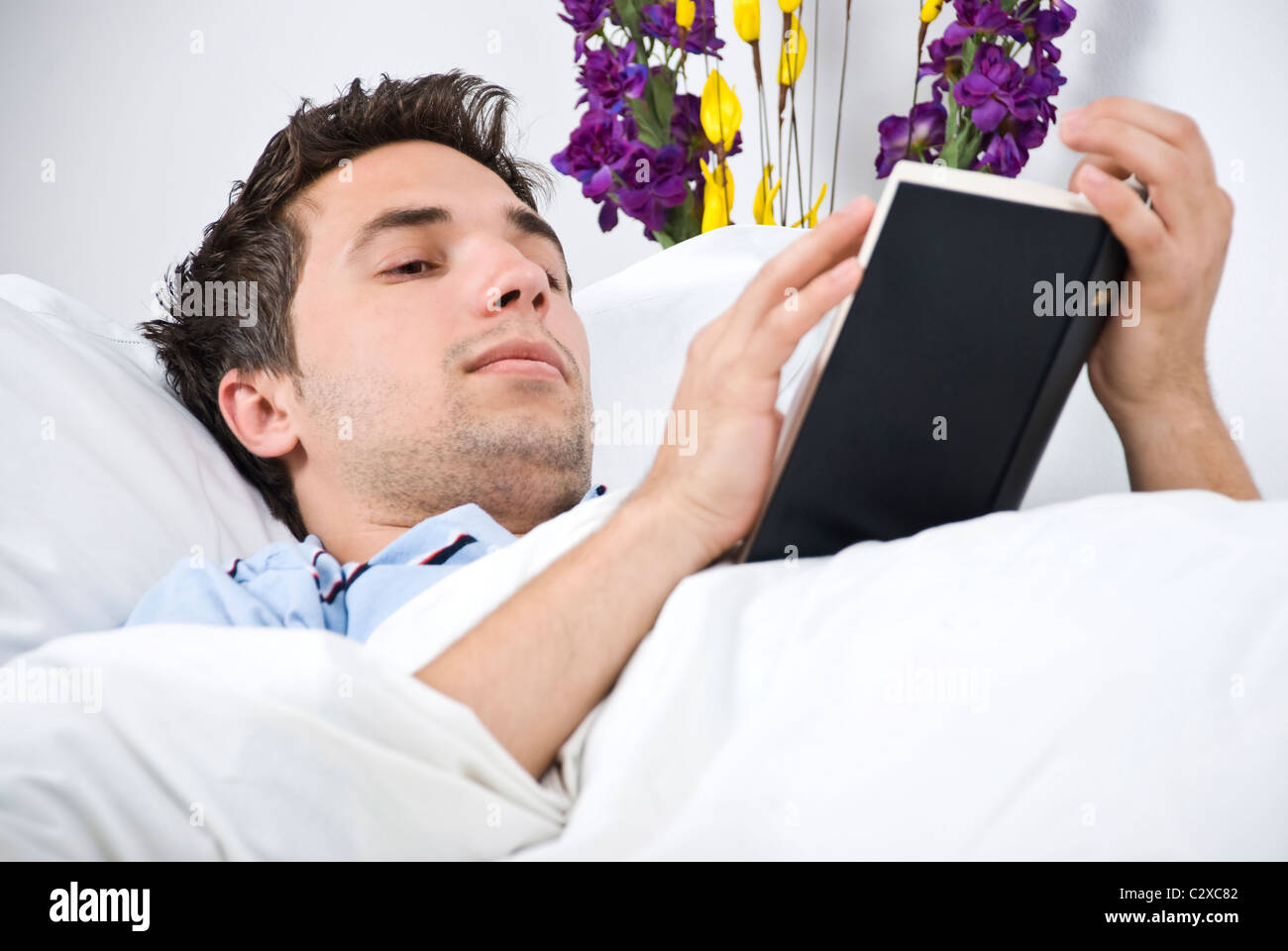 Man in suit holding book close up hi-res stock photography and images ...