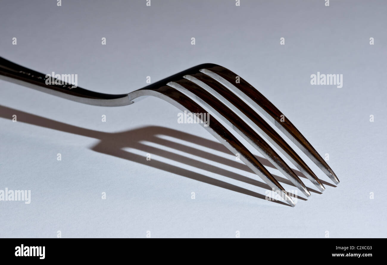 Fork with shadow on white background Stock Photo - Alamy