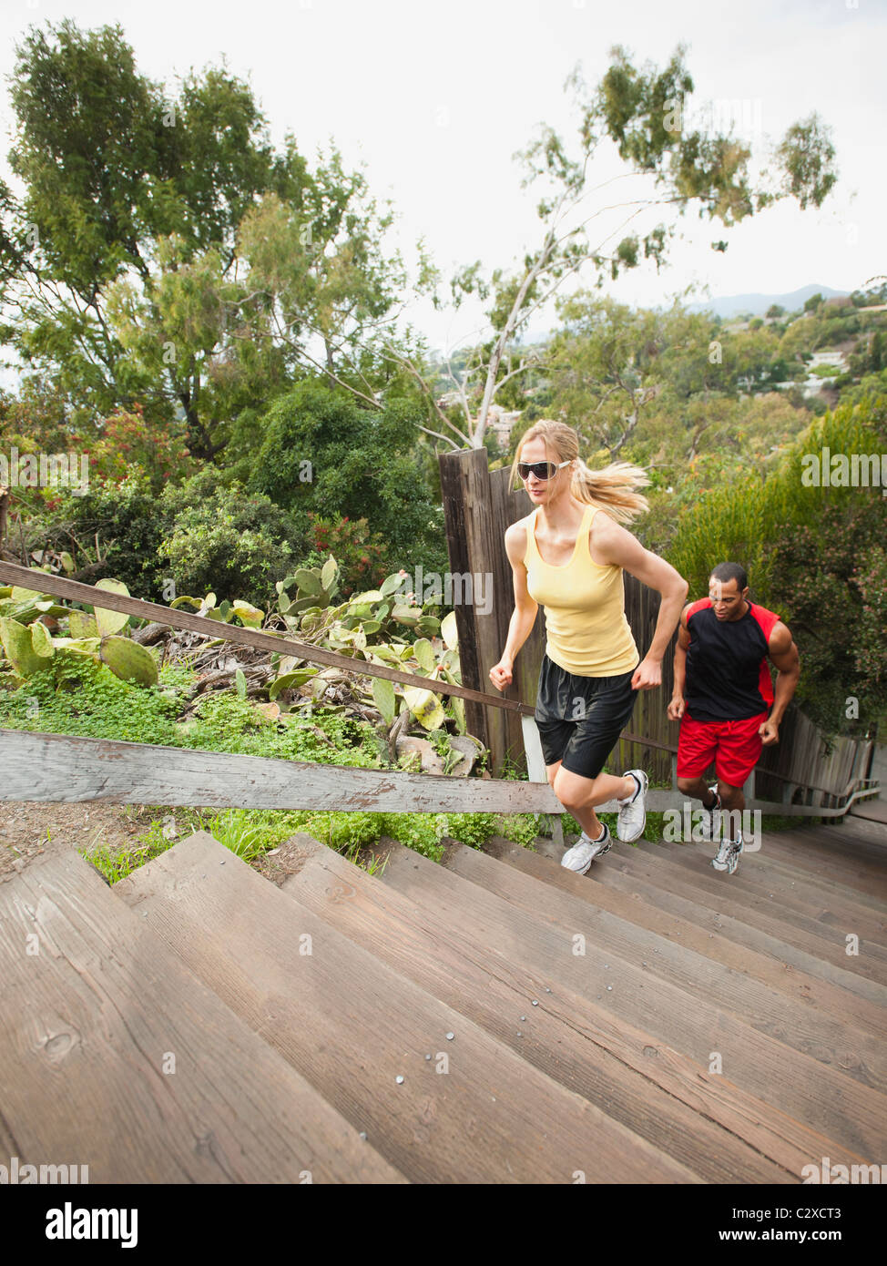 Two people ascending stairs hi-res stock photography and images - Alamy