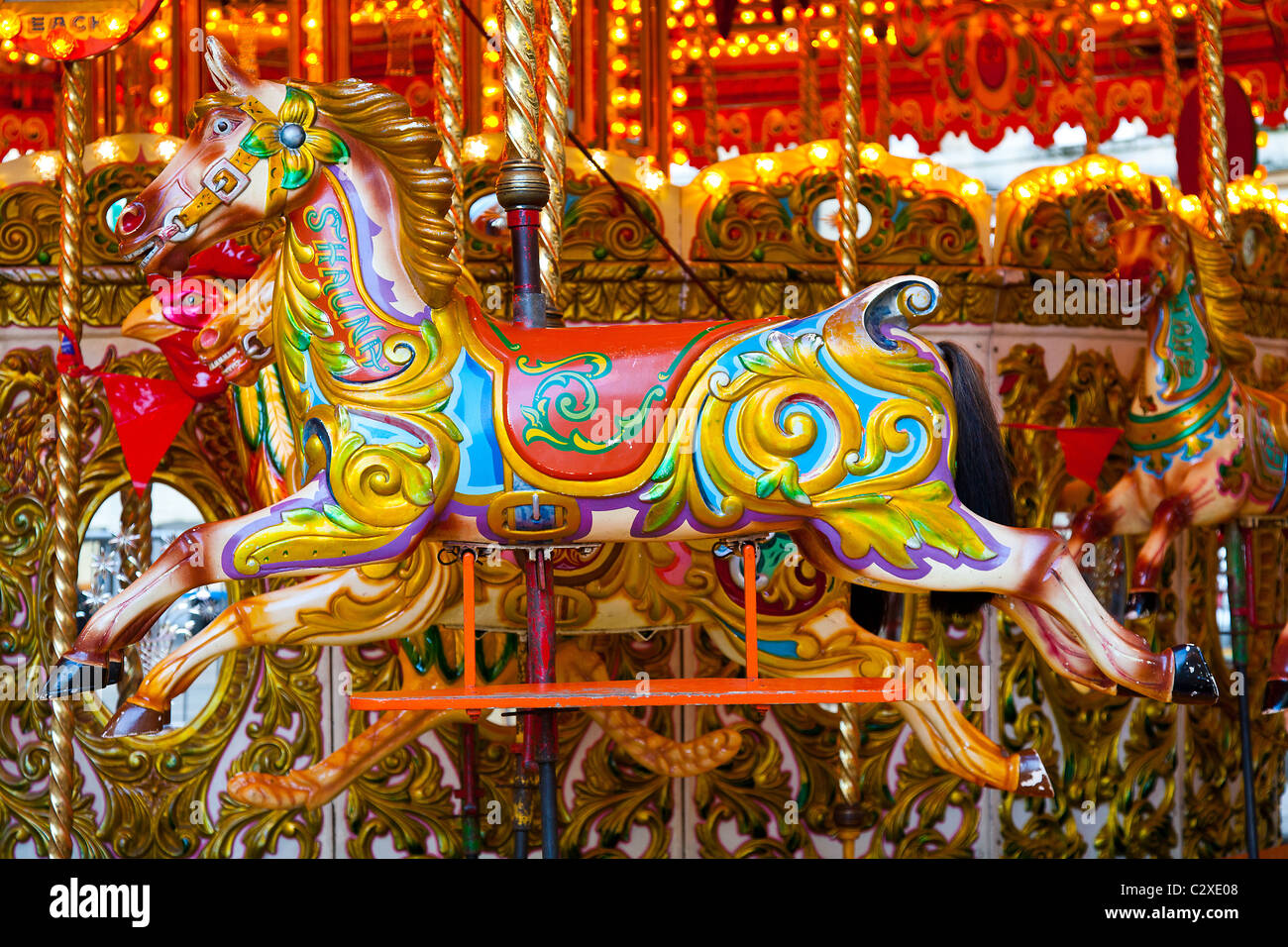 Multi coloured roundabout horse in Bath, England Stock Photo - Alamy