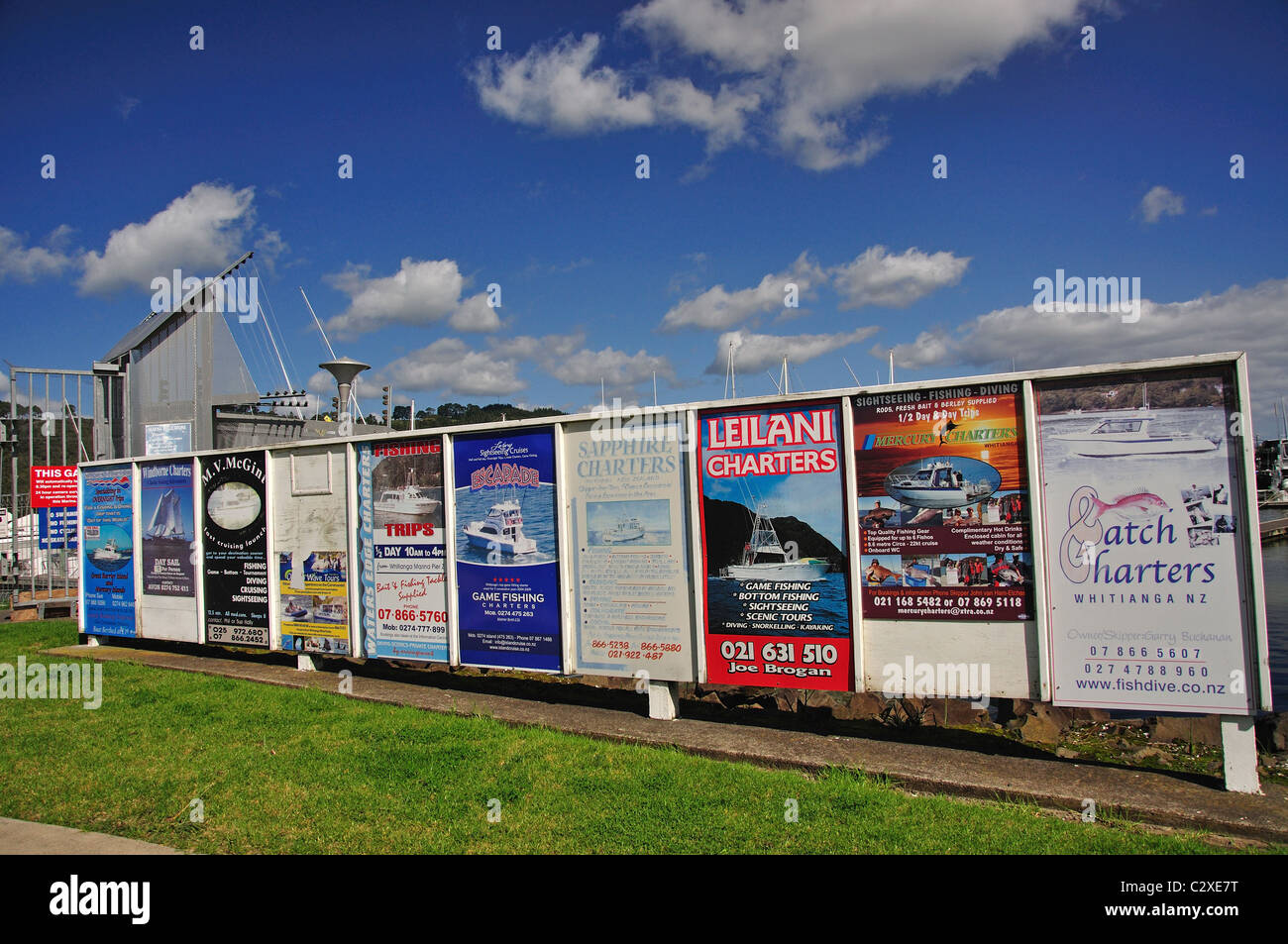 Boat charter posters outside Marina, Whitianga Harbour, Whitianga ...
