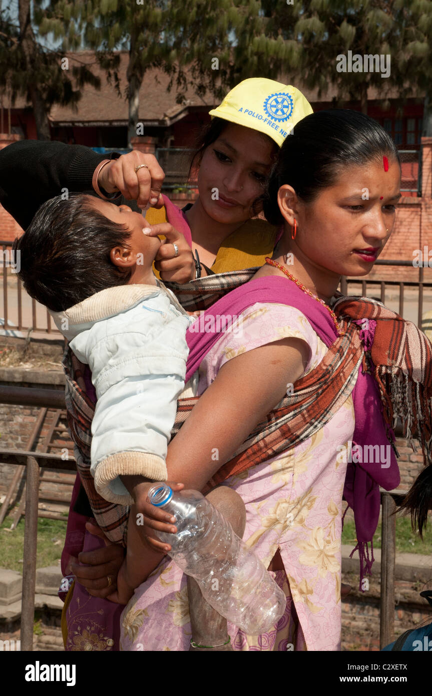 Administering oral polio vaccine in Bhaktapur, Nepal Stock Photo - Alamy