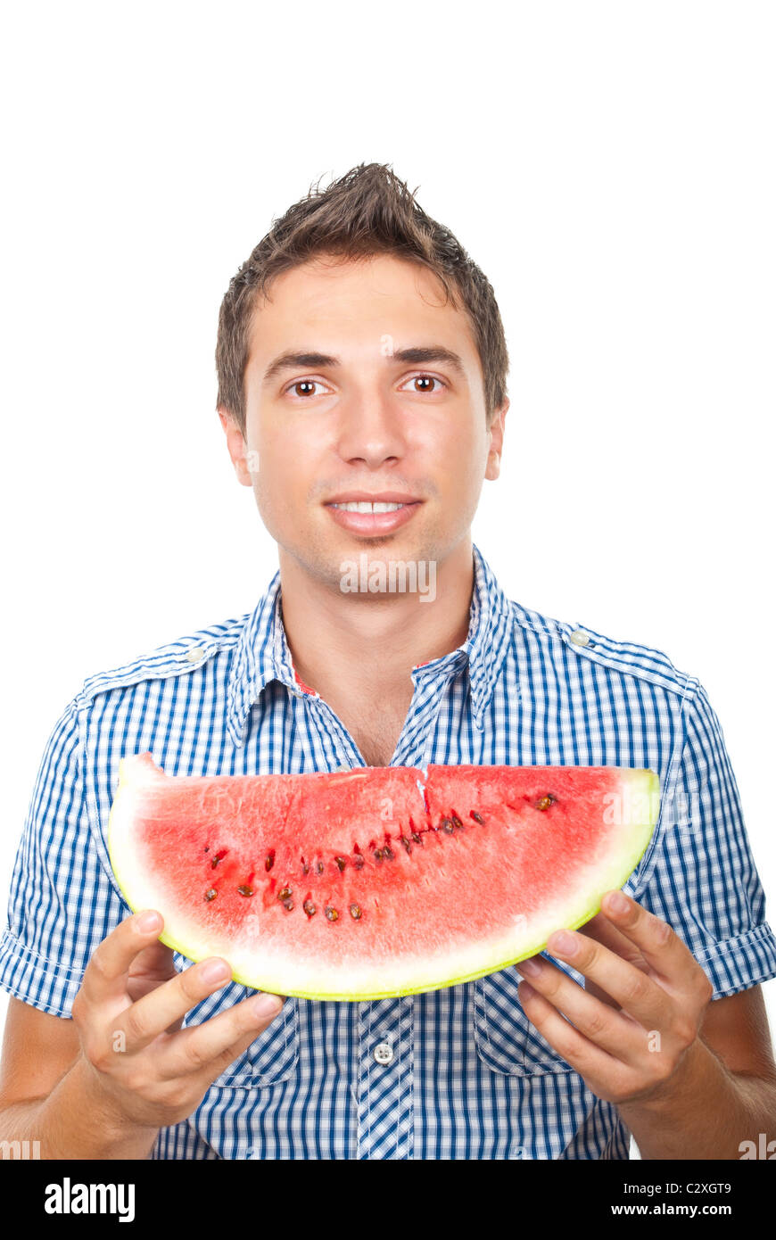 Smiling Young man showing a slice of watermelon isolated on white ...