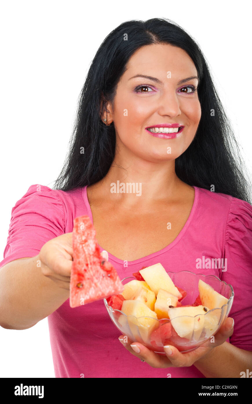Cheerful woman giving you a piece of watermelon from her salad of ...