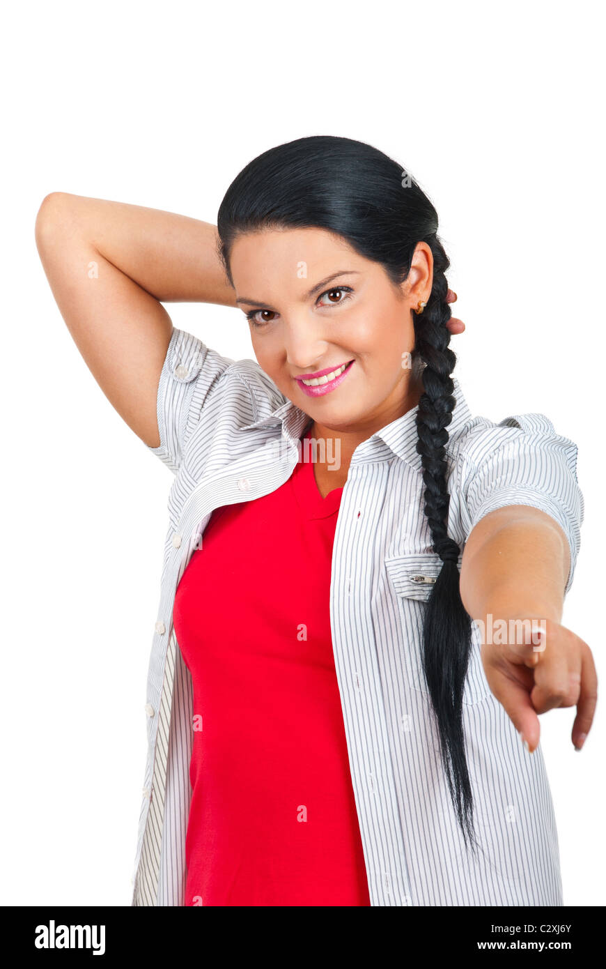 Young woman posing with hand under head and pointing to you isolated on ...