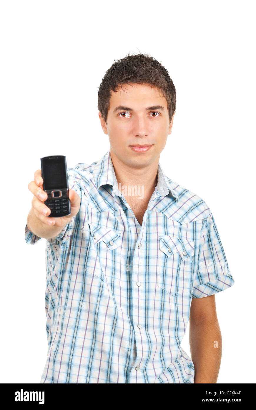 Attractive young man giving a phone mobile isolated on white background ...