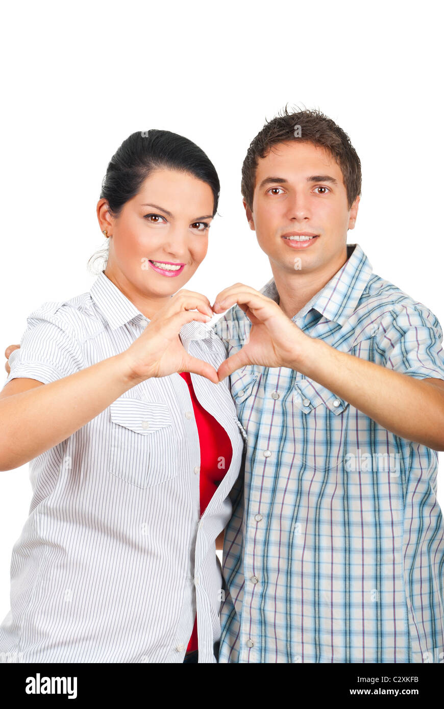 Beautiful lovely couple in love standing embracing and forming a heart ...