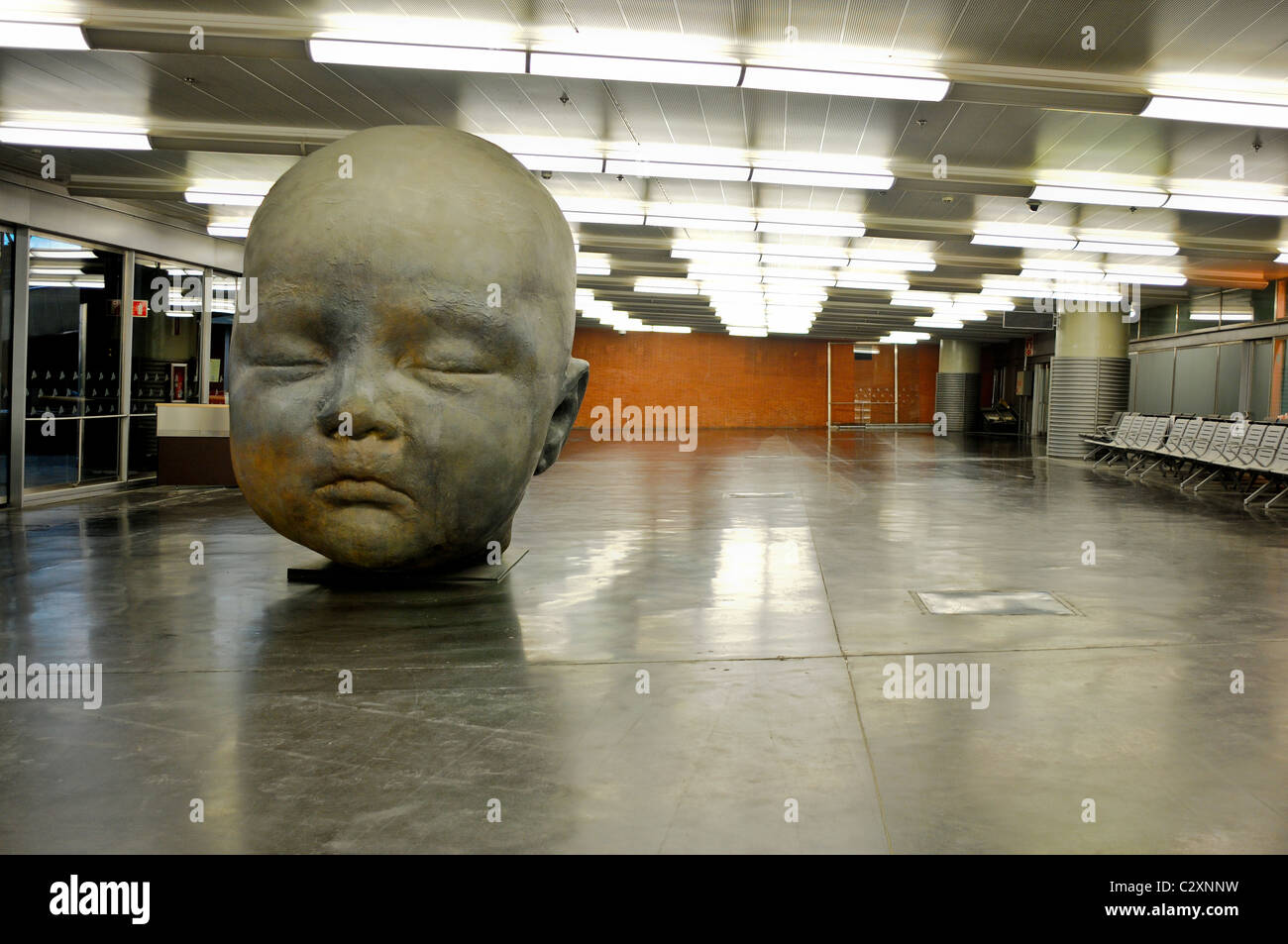 Giant baby head statue titled, "Night" in the Atocha train station in ...