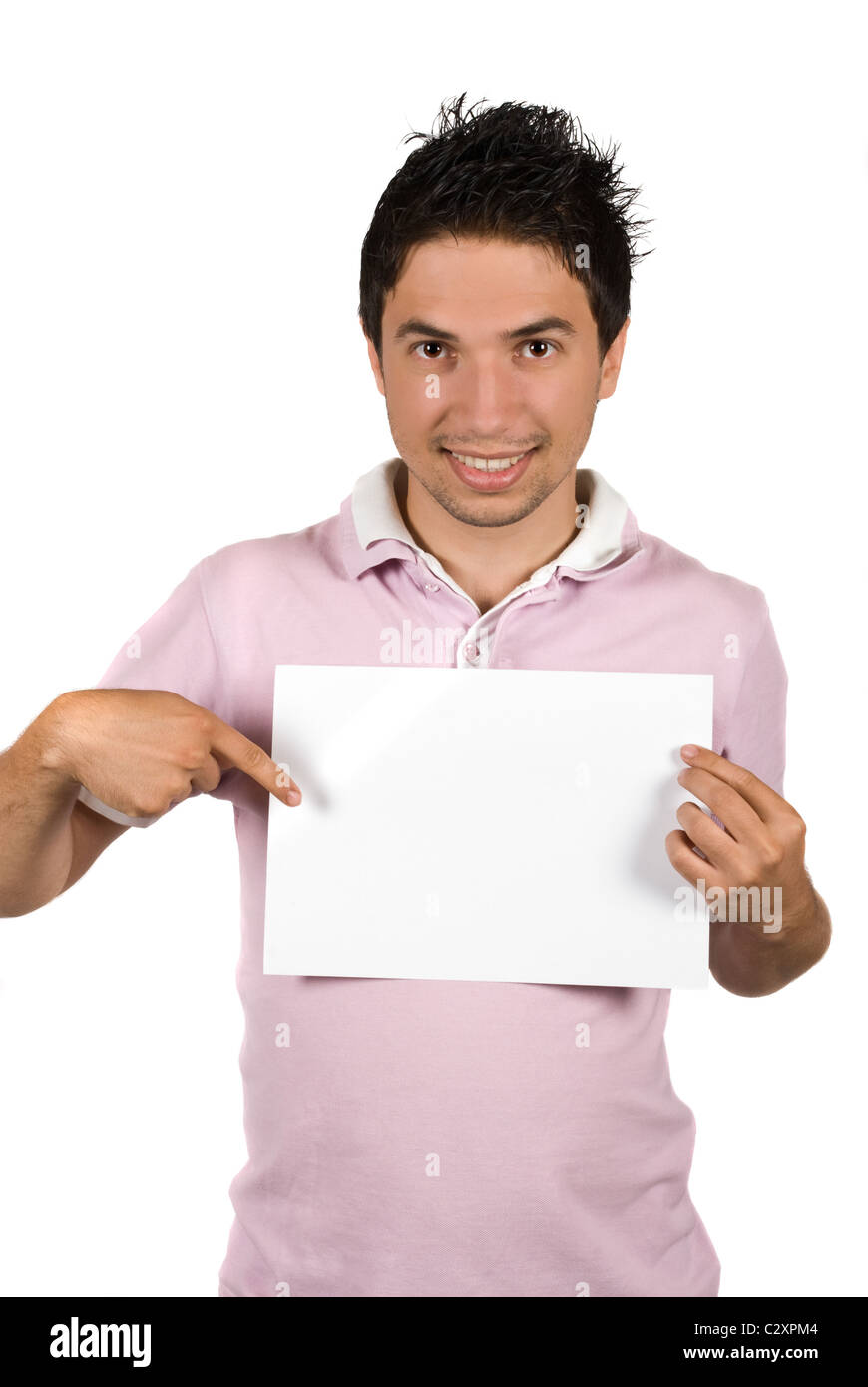 Young man pointing to a blank page to copy space isolated on white ...