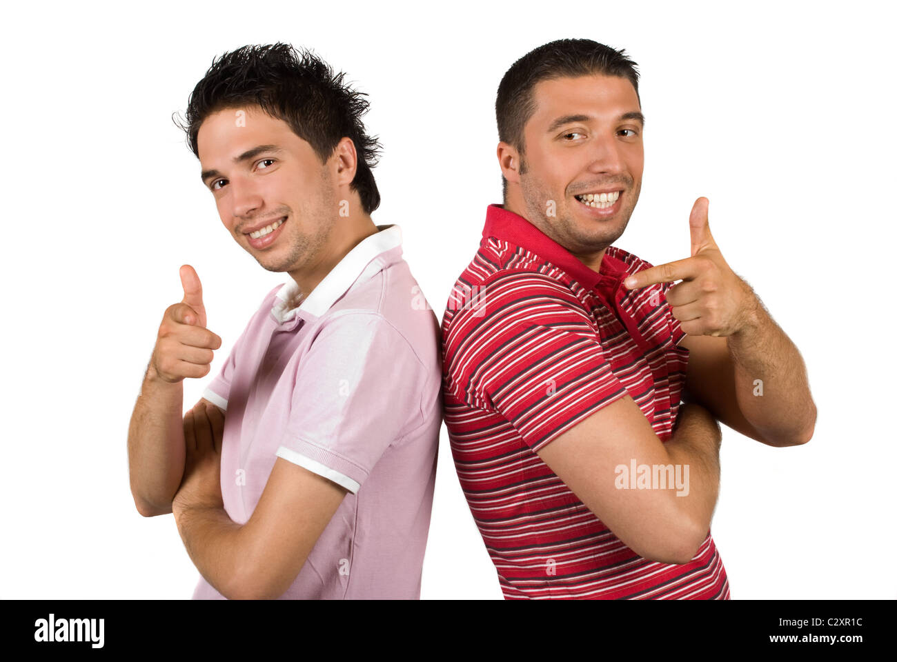 Two cool guys pointing and give thumbs-up same time and standing back ...