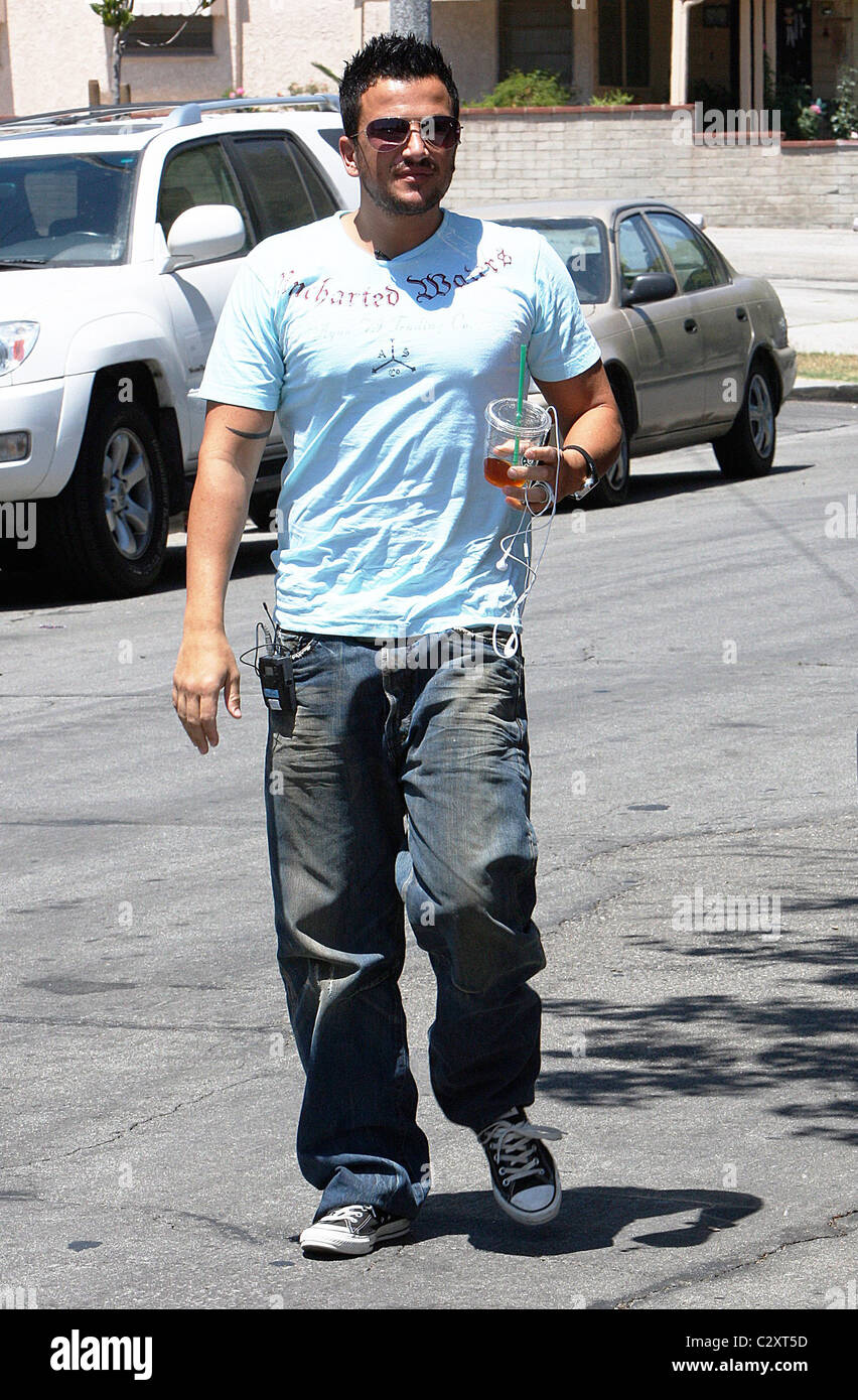 Peter Andre arriving at a recording studio carrying a Starbucks ...