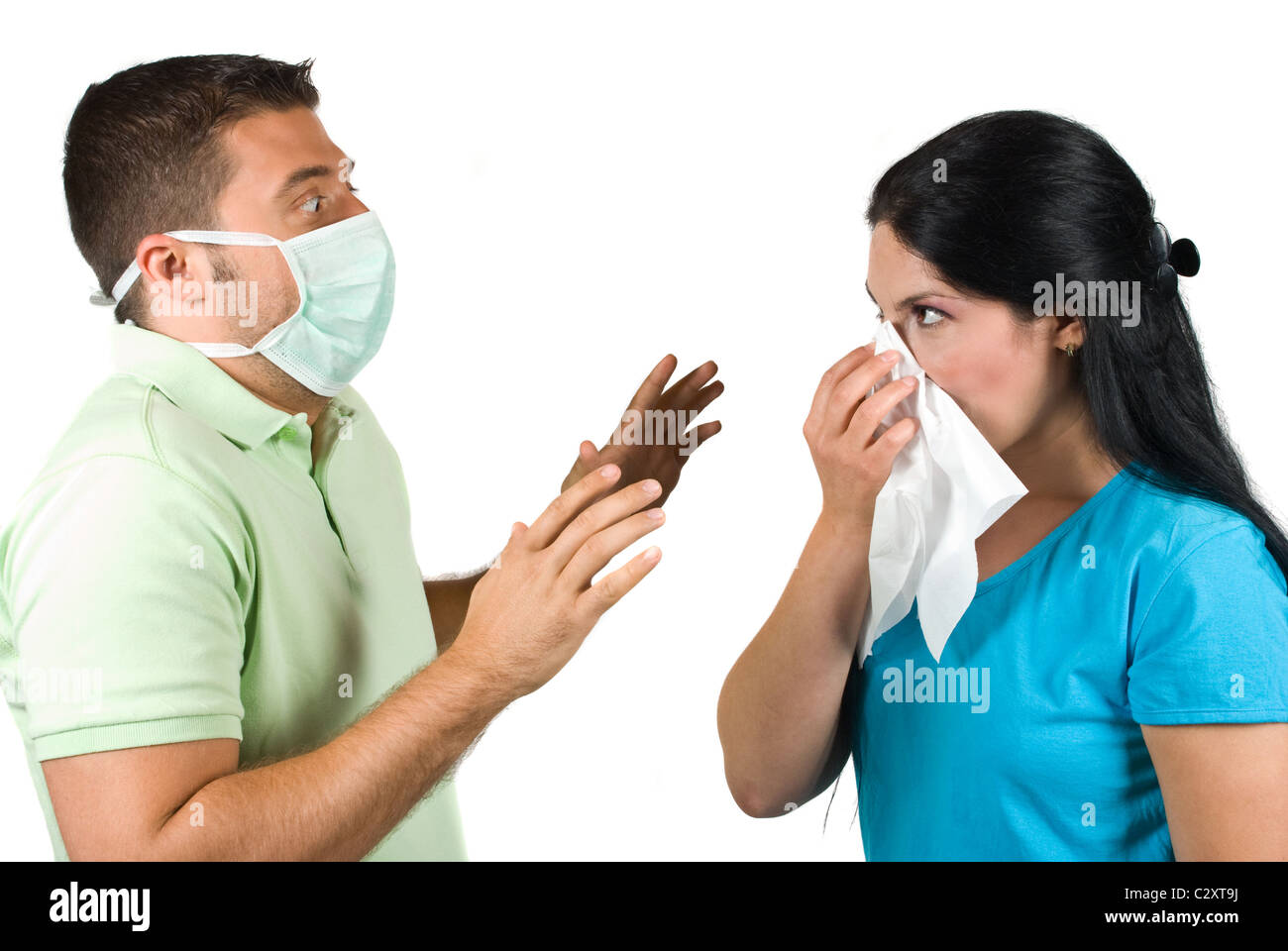 Two people couple in a situation :woman sneeze in a white napkin while ...