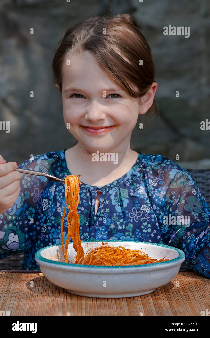 girl is eating spaghetti Stock Photo - Alamy