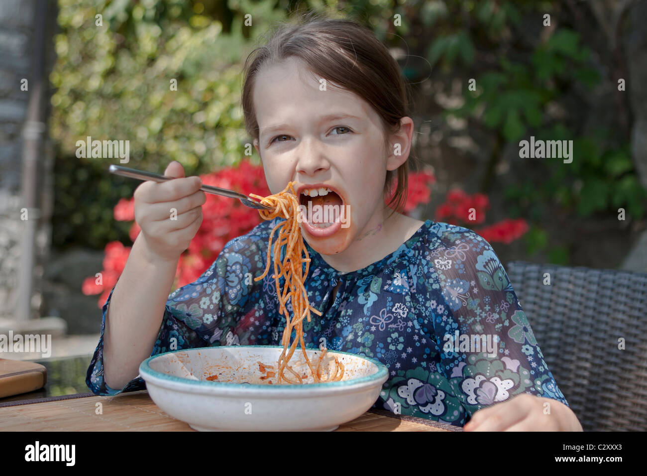 girl is eating spaghetti Stock Photo - Alamy