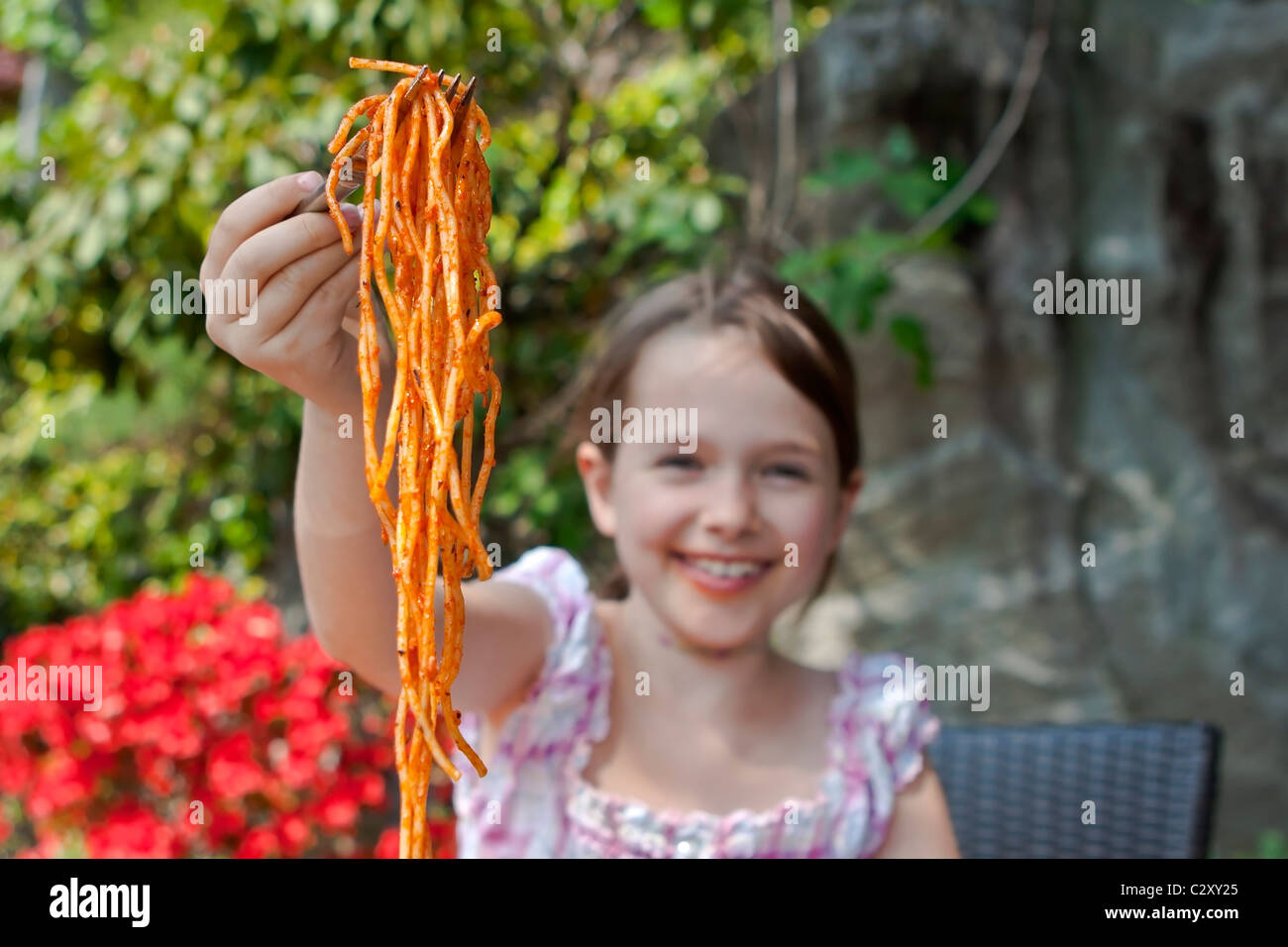 girl is eating spaghetti Stock Photo - Alamy