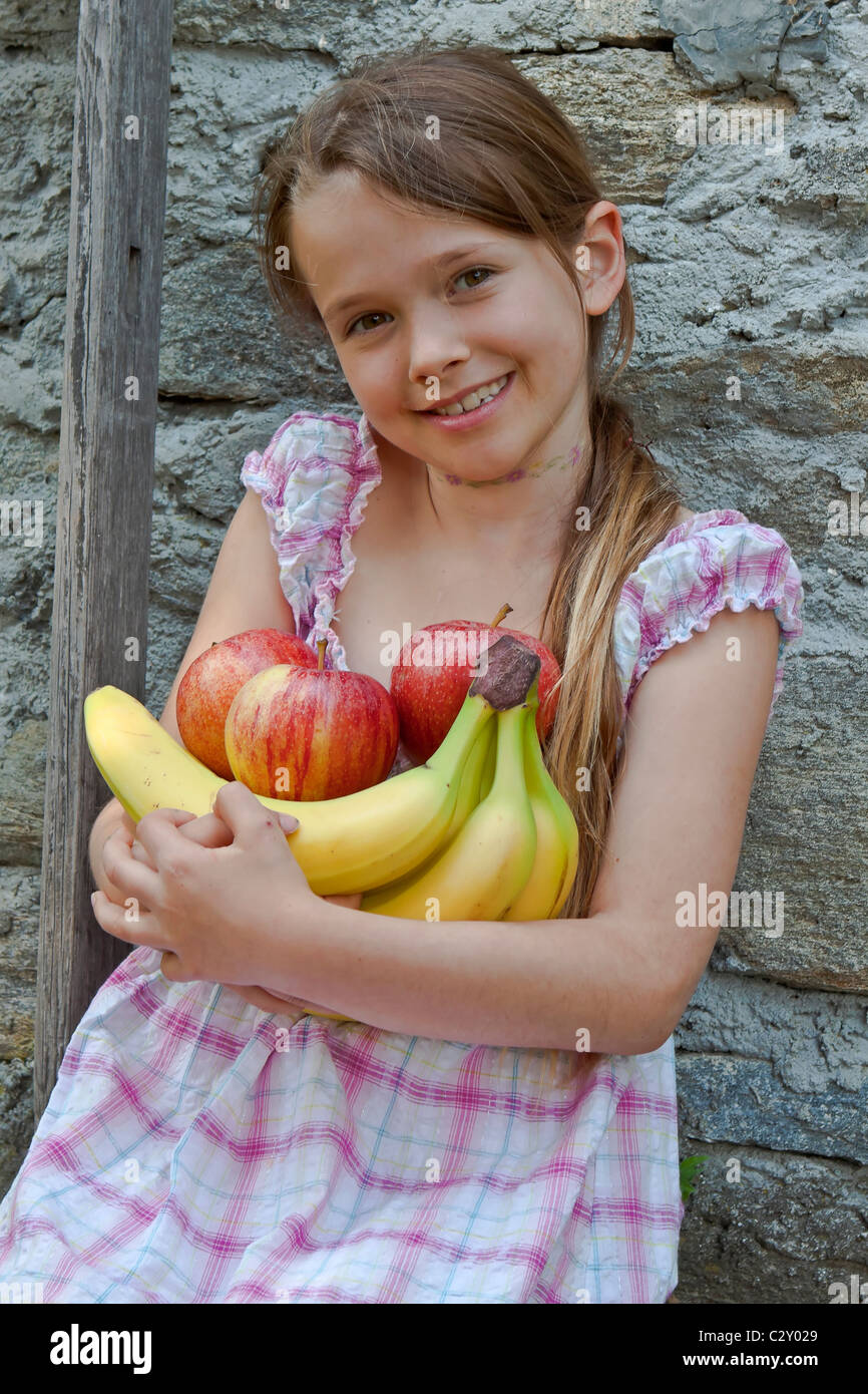 girl is eating fruits Stock Photo - Alamy