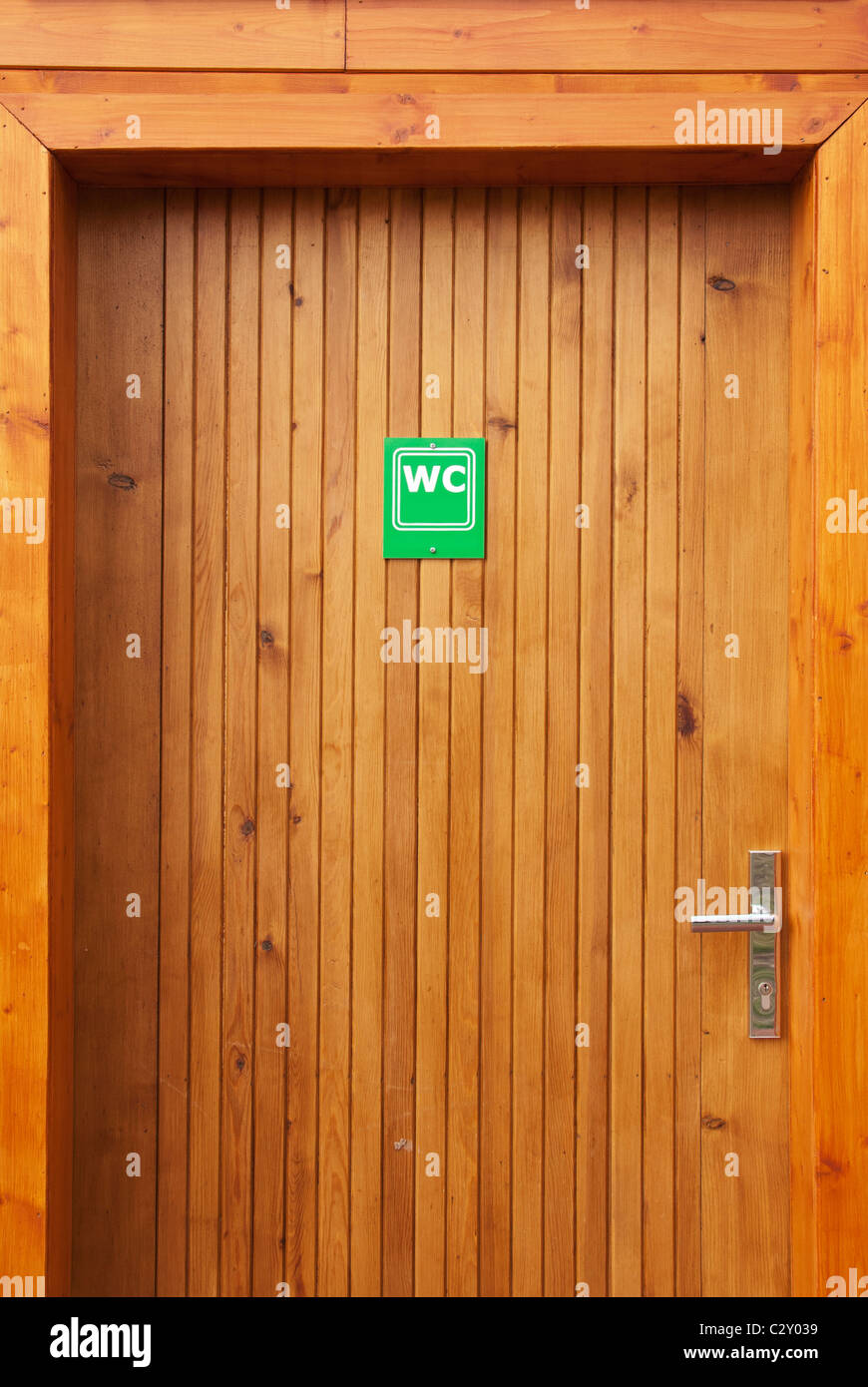 wooden door with WC sign Stock Photo - Alamy