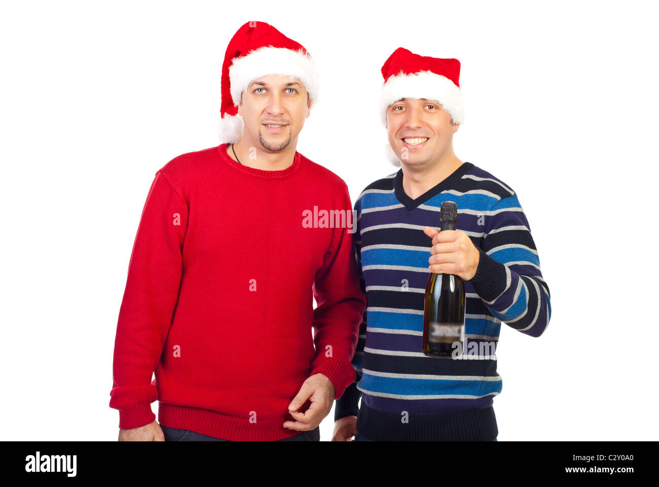 Two men celebrate Christmas and holding a bottle with champagne ...