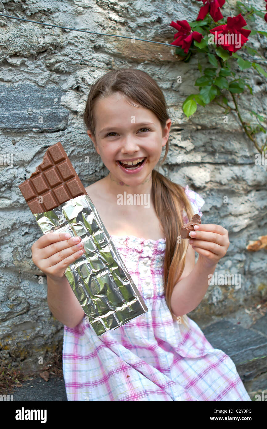 girl eating chocolate Stock Photo - Alamy