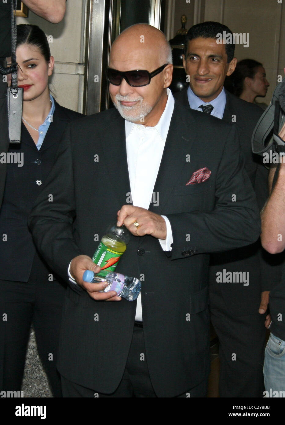 Rene Angelil leaving his Manhattan hotel with his wife New York City ...