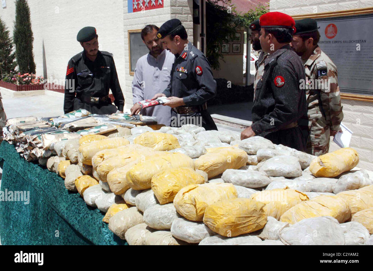 FC officials inspect seized packets of drug (Charas) which were ...