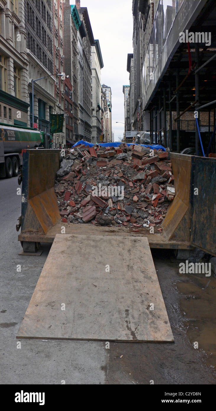 Dumpster with rubble from renovation of interior of building on ...