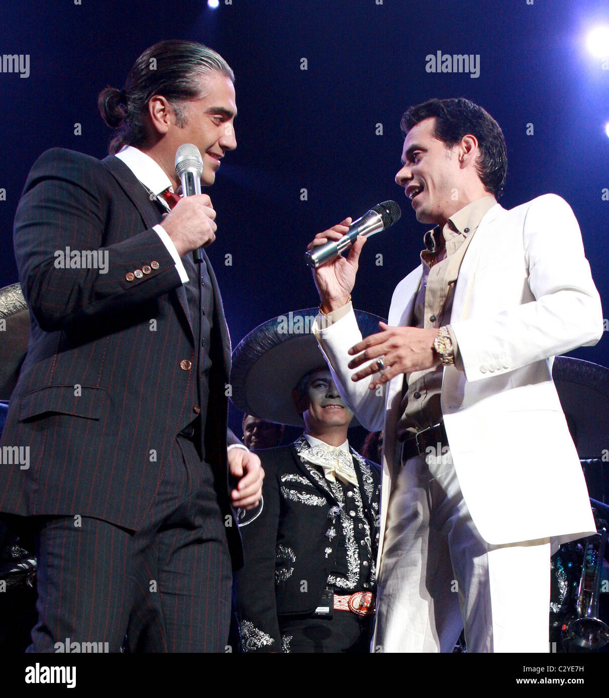 Alejandro Fernandez and Marc Anthony performing at the Juntos en ...