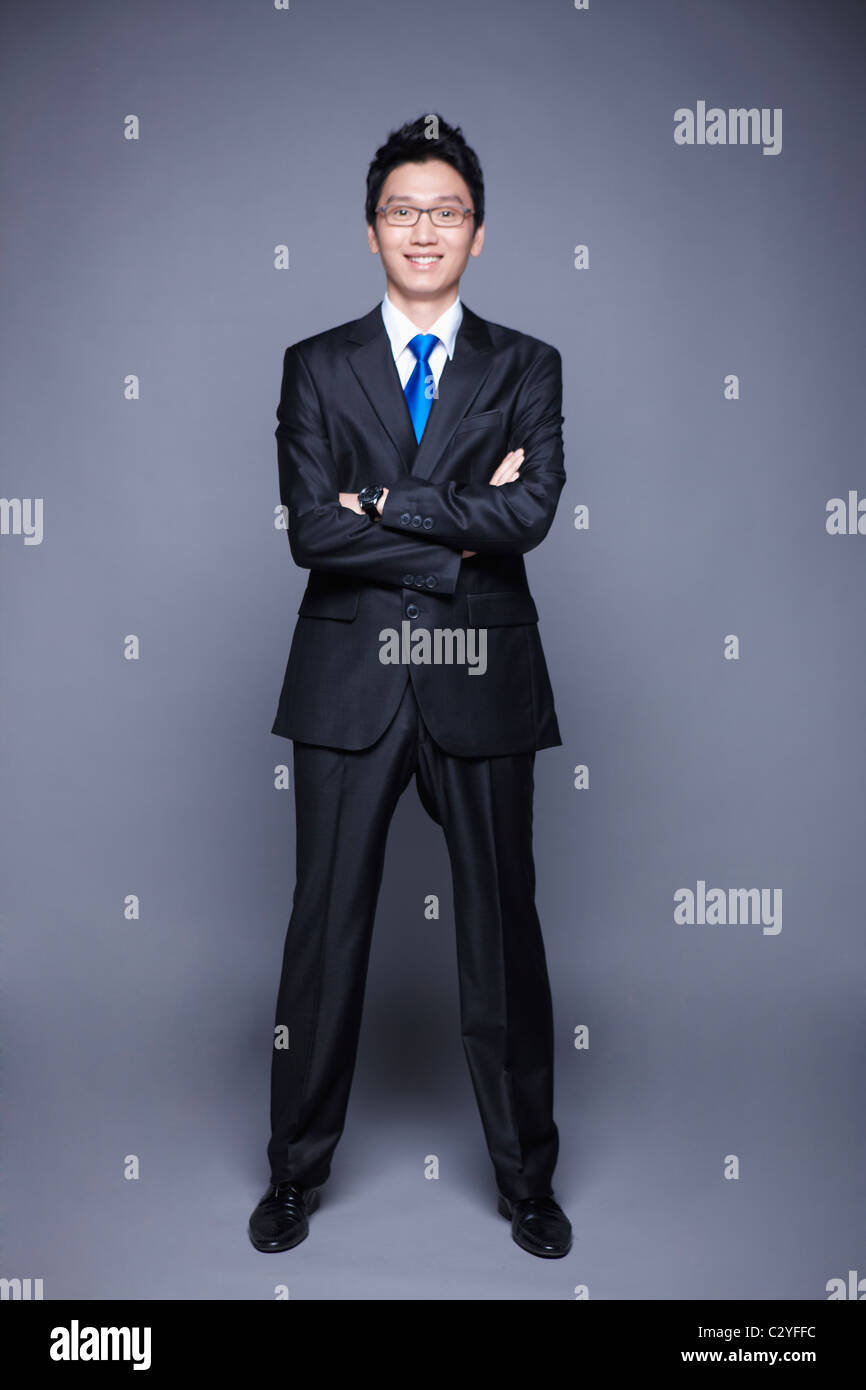 businessman posing crossed arms Stock Photo - Alamy