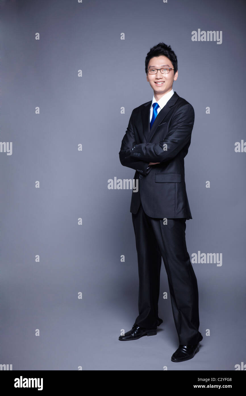 businessman posing crossed arms Stock Photo - Alamy