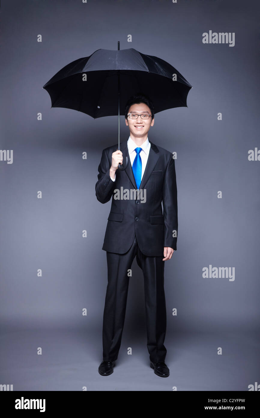 Using umbrella hi-res stock photography and images - Alamy