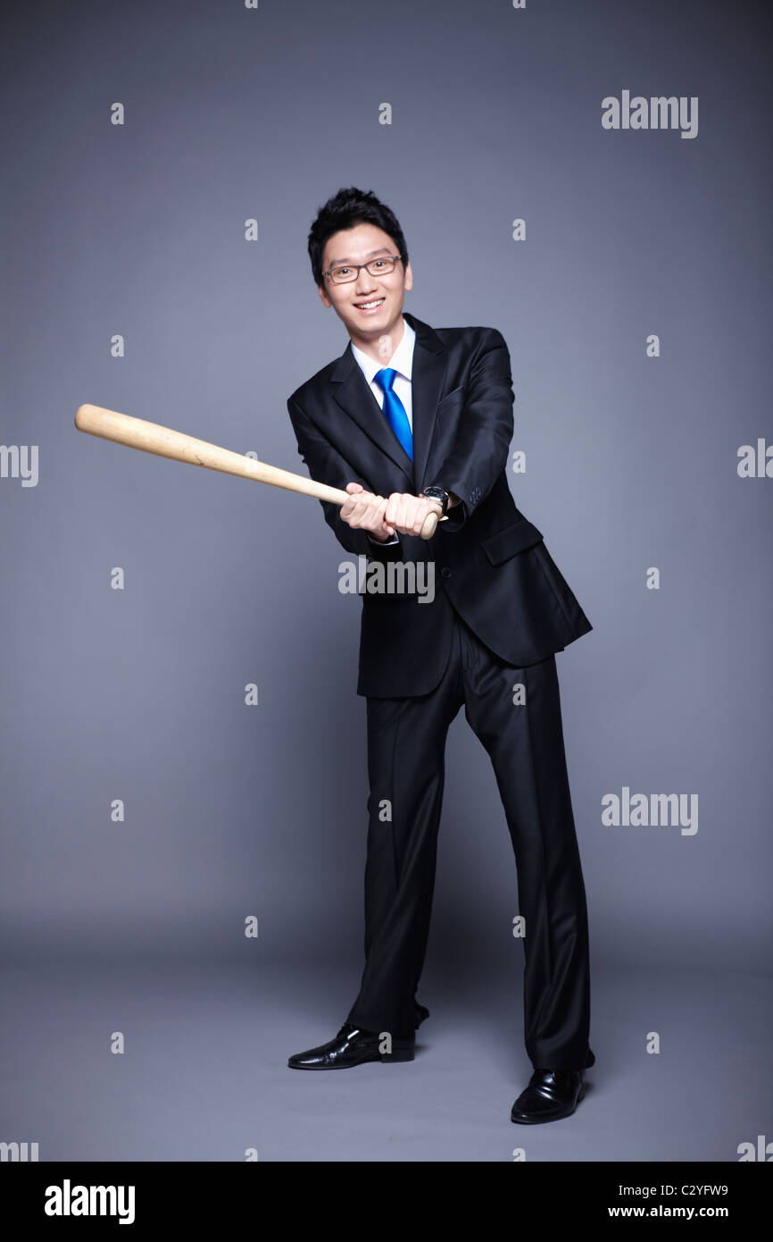 businessman posing swing baseball bat Stock Photo - Alamy