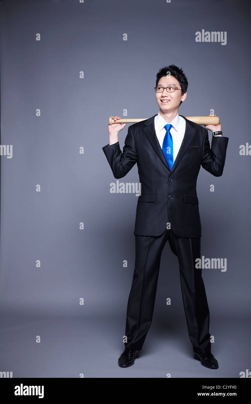 Business man holding baseball bat hi-res stock photography and images ...