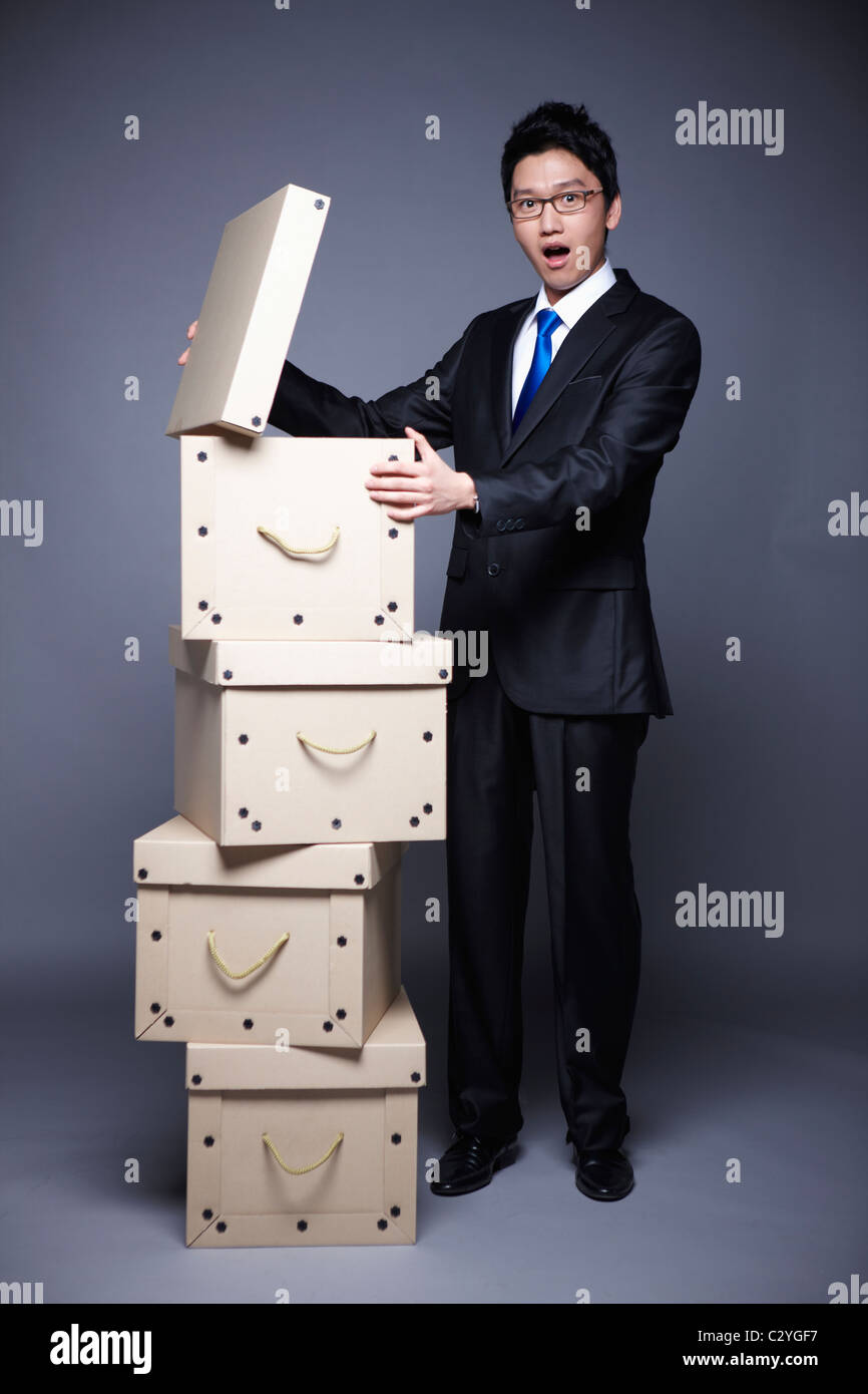 businessman open the box Stock Photo - Alamy