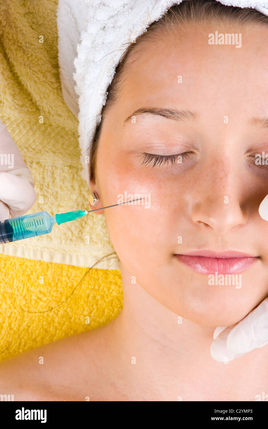 Close up of young woman getting a botox injection in her cheek Stock ...