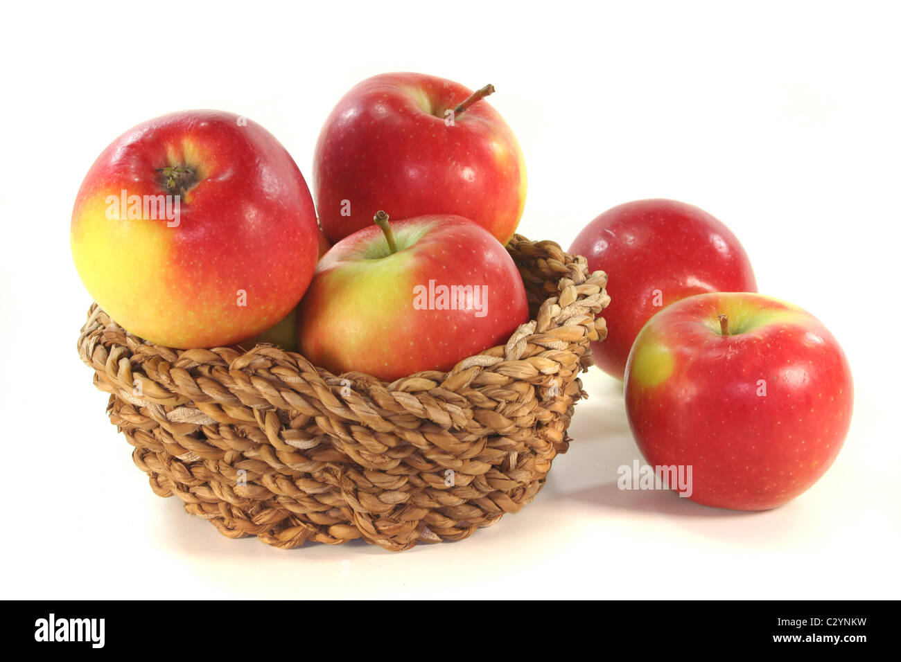 red and yellow apples in the basket before a white background Stock ...