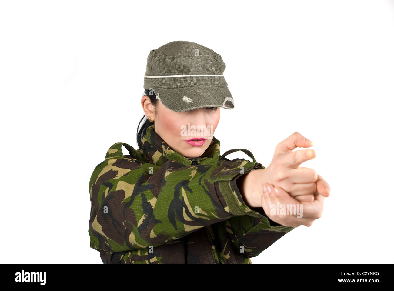 Army soldier gesturing with hands like he shoot with a gun isolated on ...