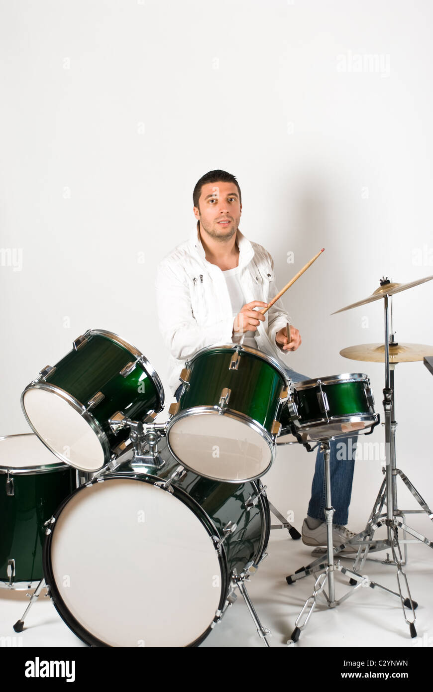 Active drummer playing at drums set in a studio Stock Photo - Alamy