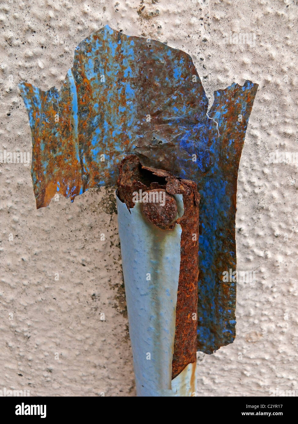 Damaged, Rusted Rain water waste away on parapet wall Stock Photo - Alamy