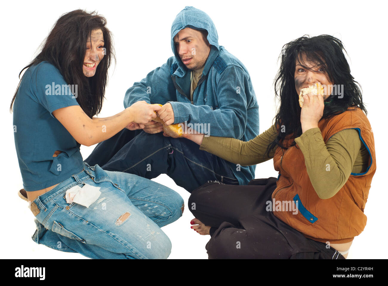 Three beggars sharing a bread and eating isolated on white background ...