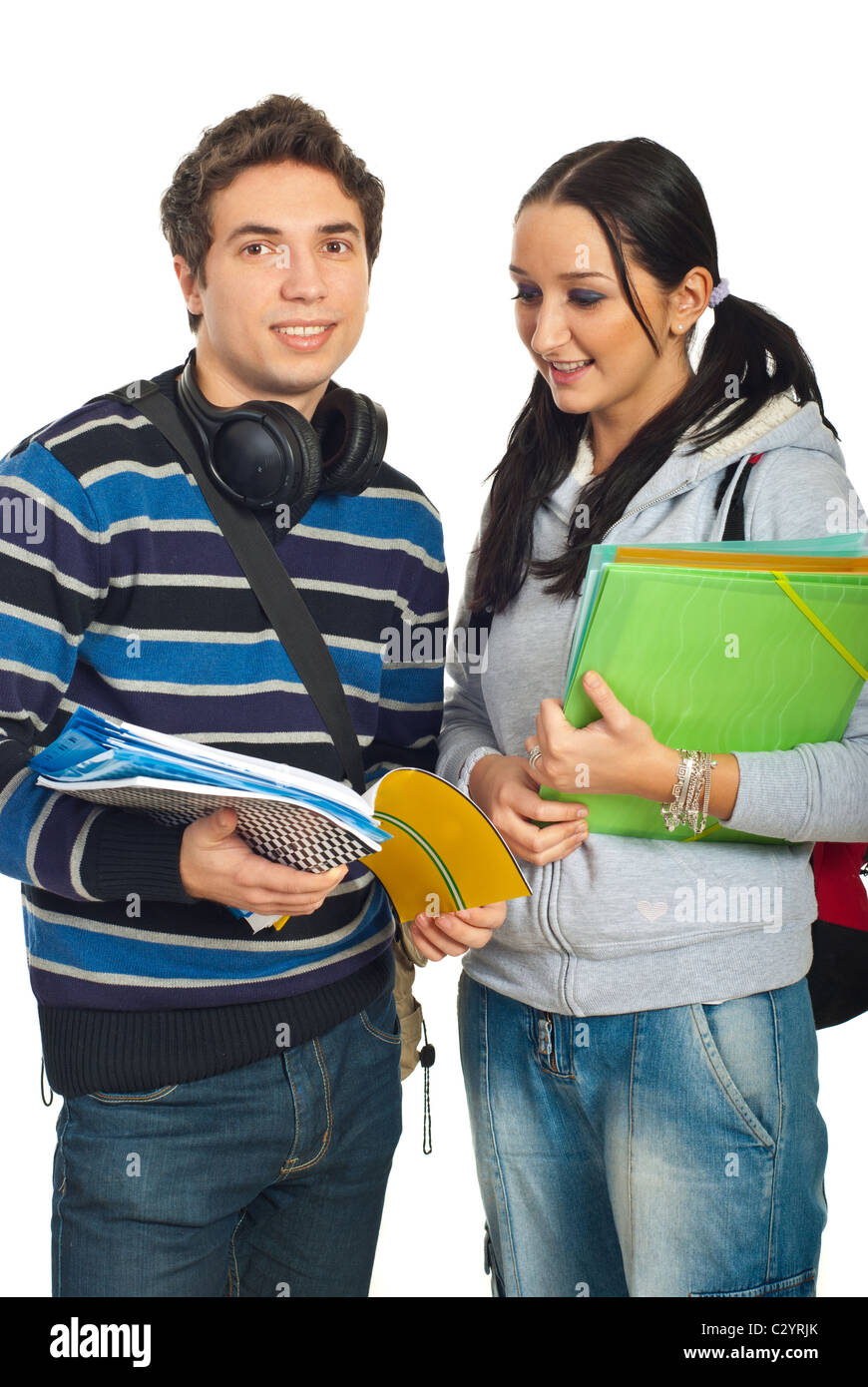 Happy couple of students studying together isolated on white background ...