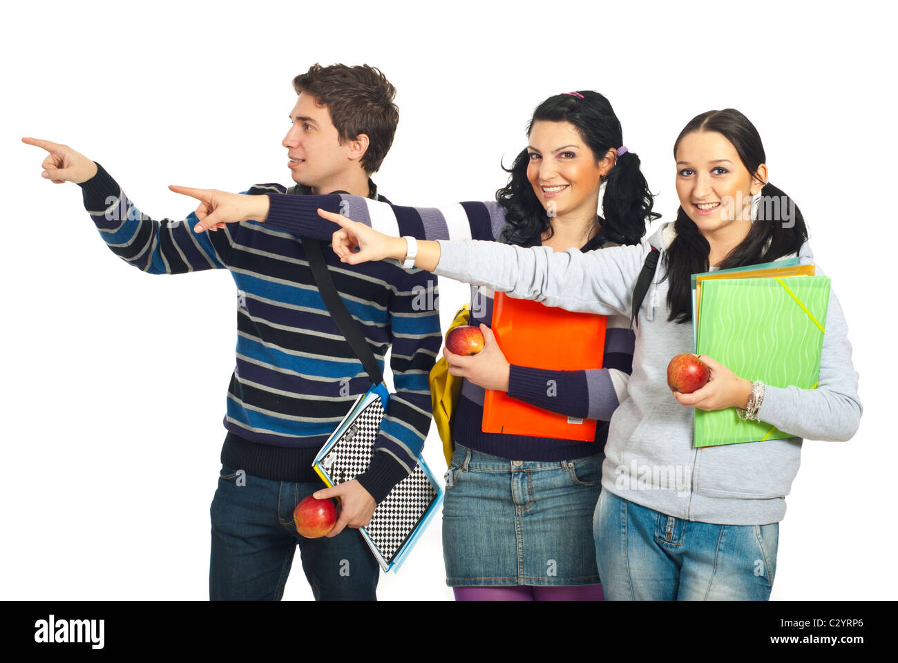 Group of three students in a row pointing to copy space left side ...